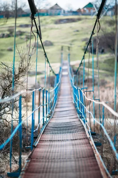 Old suspension bridge Stock Photo by ©Gladkov 155256324