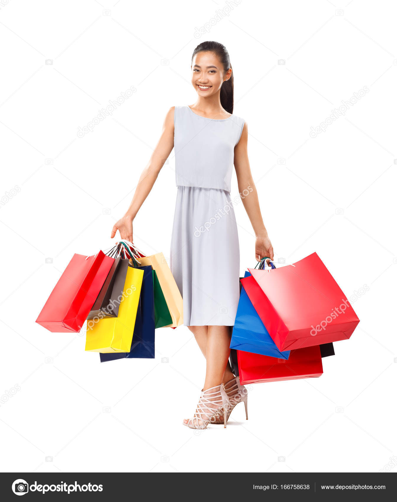 Woman holding shopping bags — Stock Photo © Gladkov #166758638 Woman holding shopping bags — Stock Photo © Gladkov #166758638