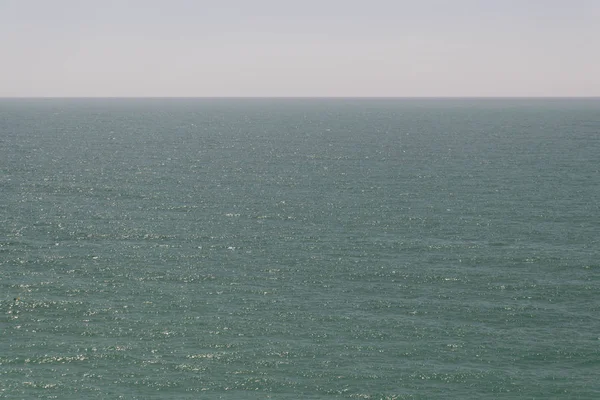 Horizon line over sea in a sunny day. - Stock Image - Everypixel