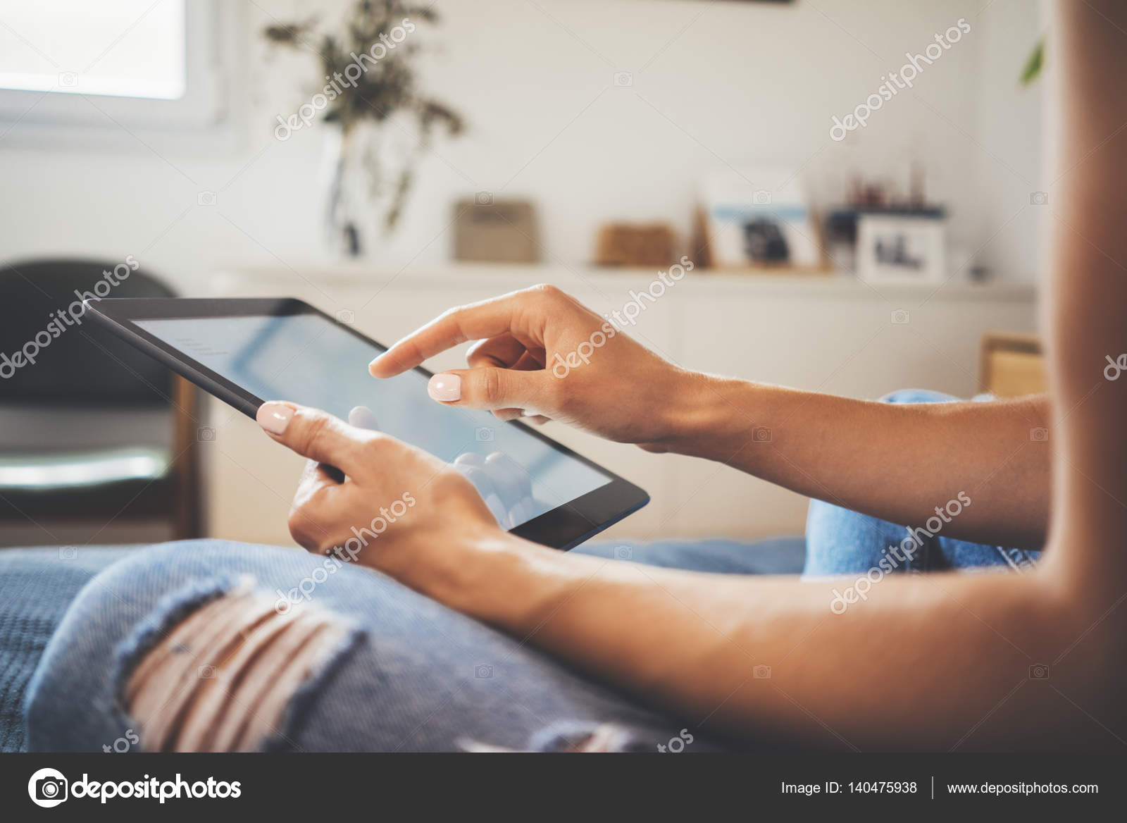 Female using modern digital tablet Stock Photo by ©Im_Yanis 140475938