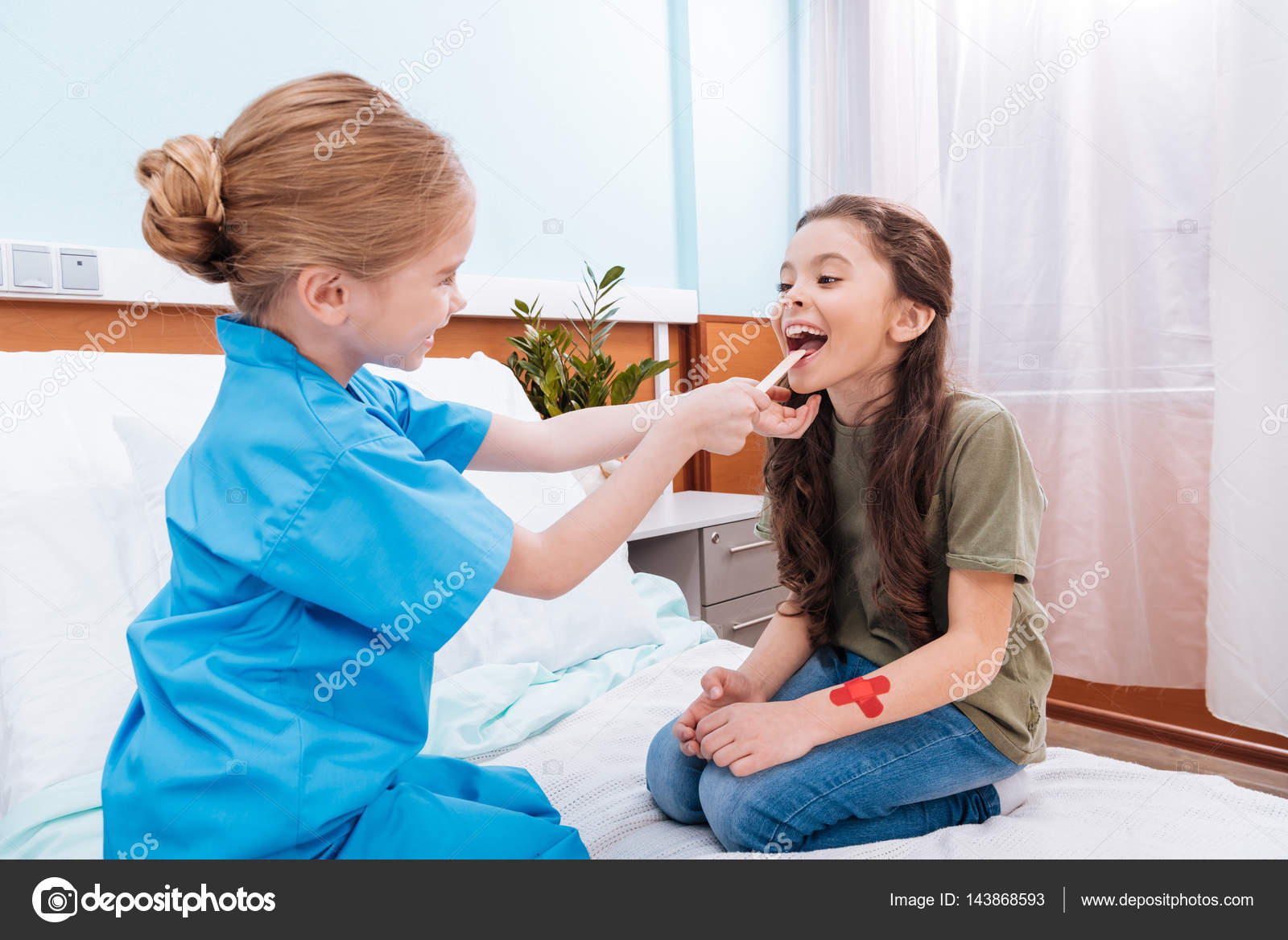 Kids playing nurse and patient — Stock Photo © ZaraMuzafarova #143868593