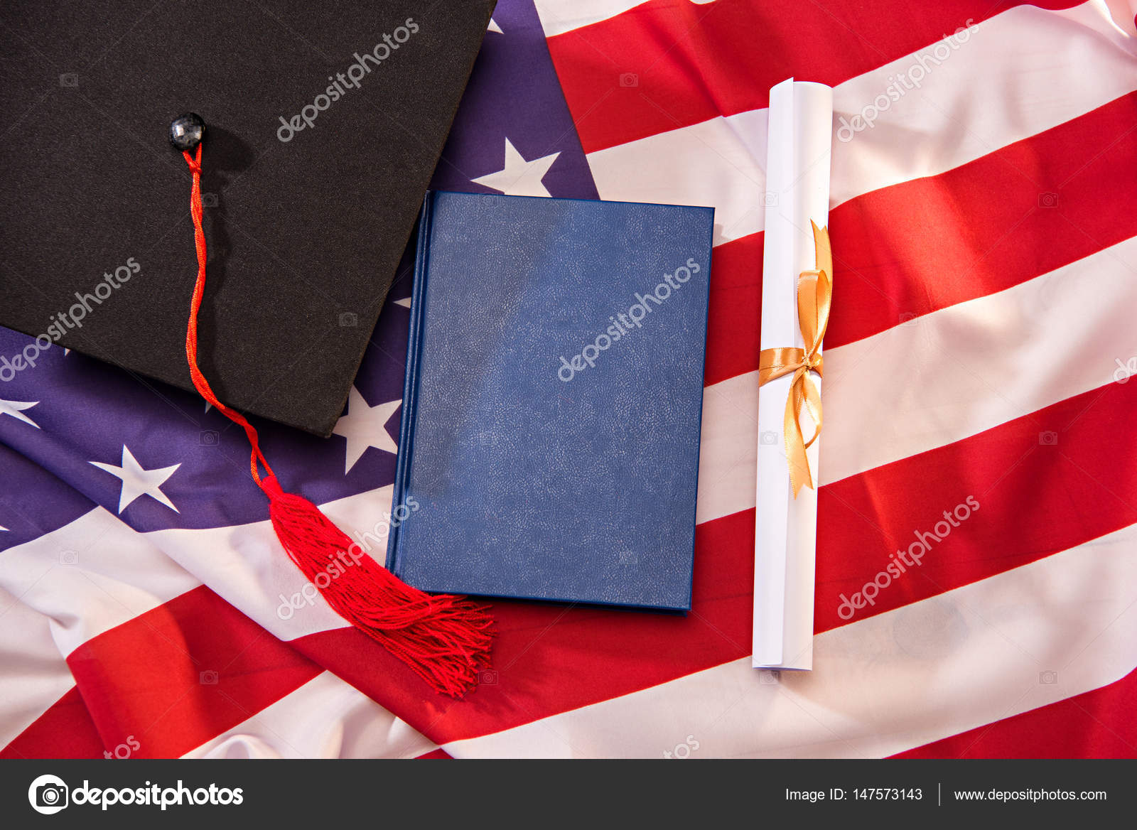 Graduation cap and diploma on usa flag — Stock Photo © SergPoznanskiy ...