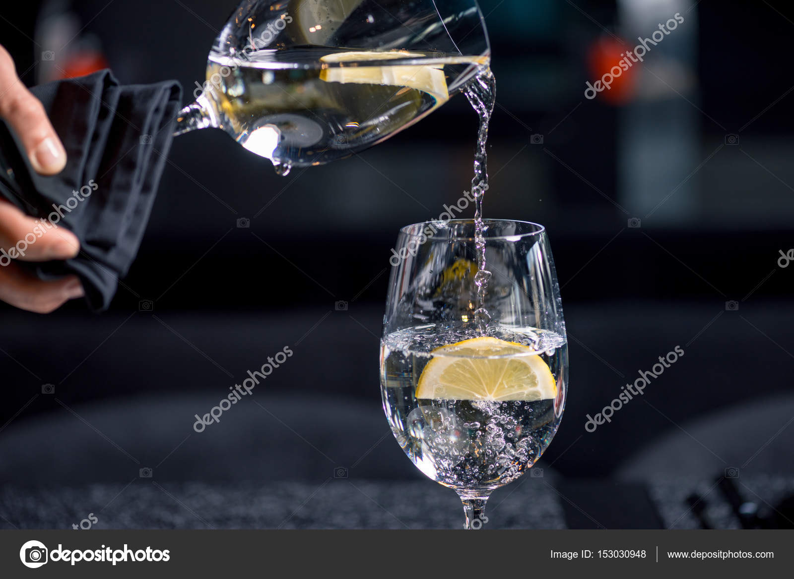 Water pouring into glass — Stock Photo © AndrewTovstyzhenko #153030948
