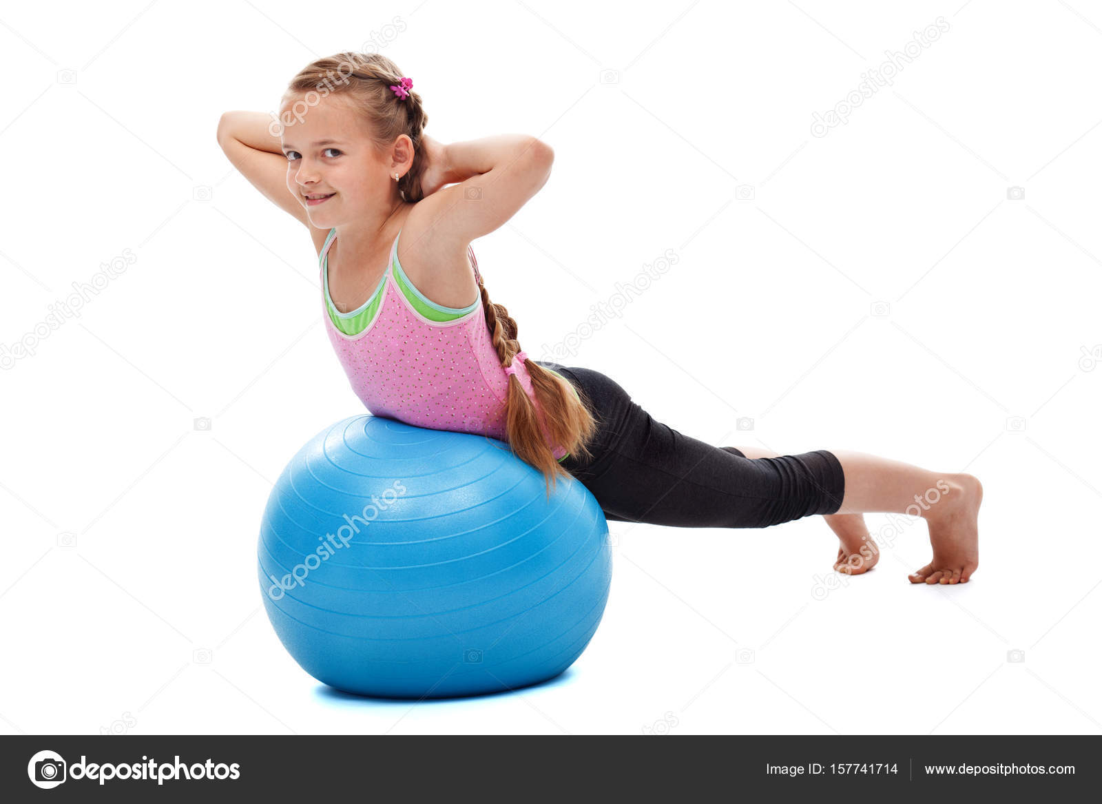 Young girl doing back strengthening gymnastic exercises Stock Photo by ...