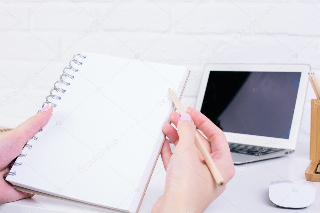 Lady's hands drawing in notepad Stock Photo by ©peshkova 125747340