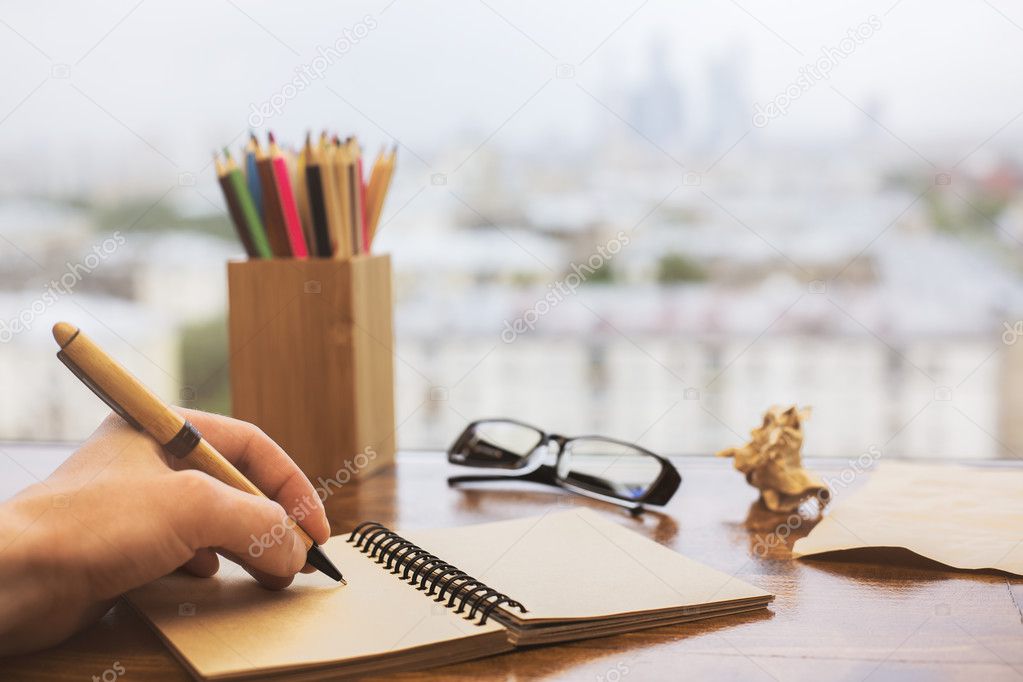 Hand writing in notepad closeup — Stock Photo © peshkova #126433372