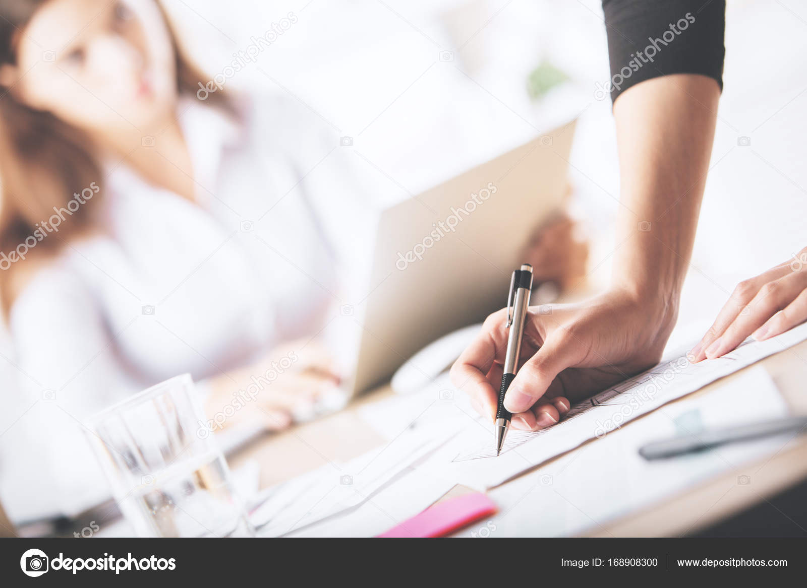Hands doing paperwork and using laptop Stock Photo by ©peshkova 168908300