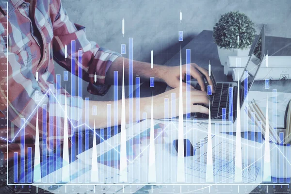 Double exposure of stock graph with businessman typing on computer in ...