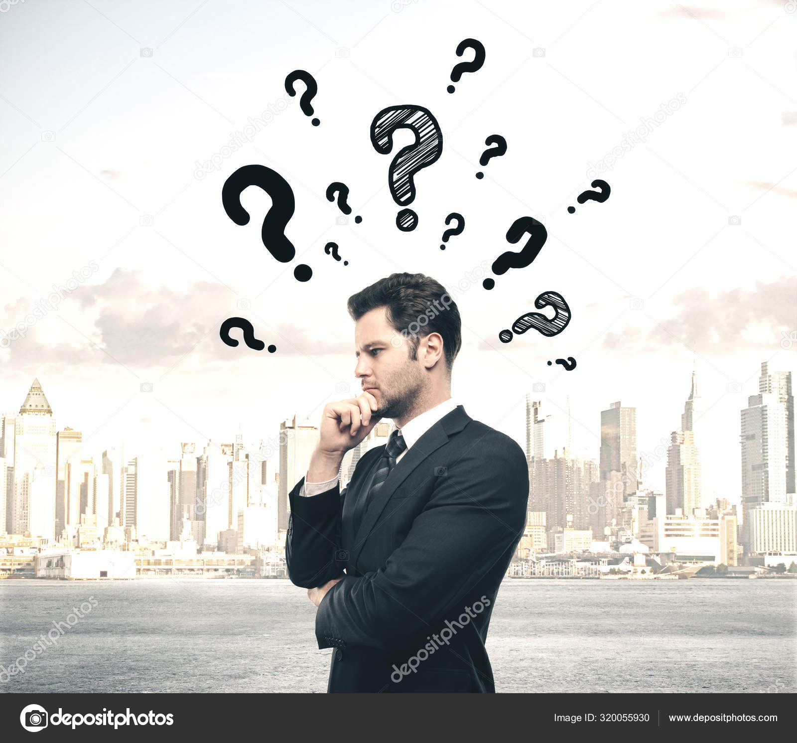 Businessman with drawing question mark — Stock Photo © peshkova #320055930