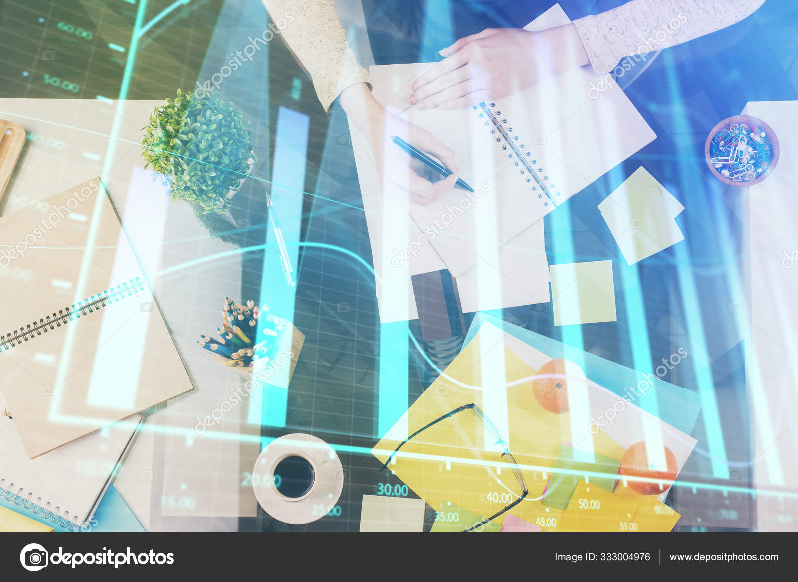 Hand taking notes in notepad. Forex chart holograms in front. Concept ...