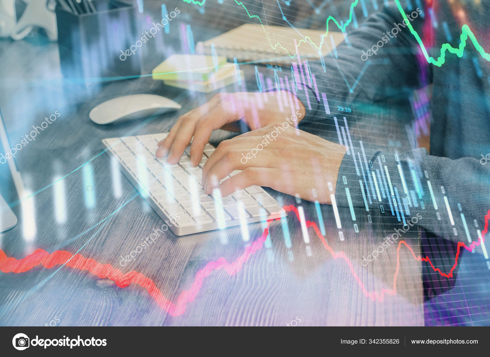 Stock graph with businessman typing on computer in office on background ...