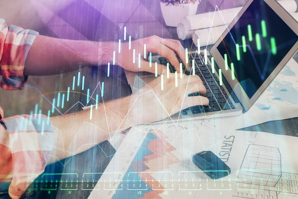 Double exposure of stock graph with businessman typing on computer in ...