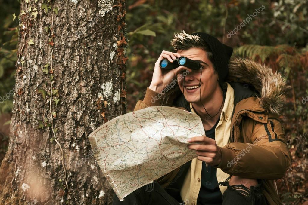 Travelers, man sith map Stock Photo by ©carballo 128841450