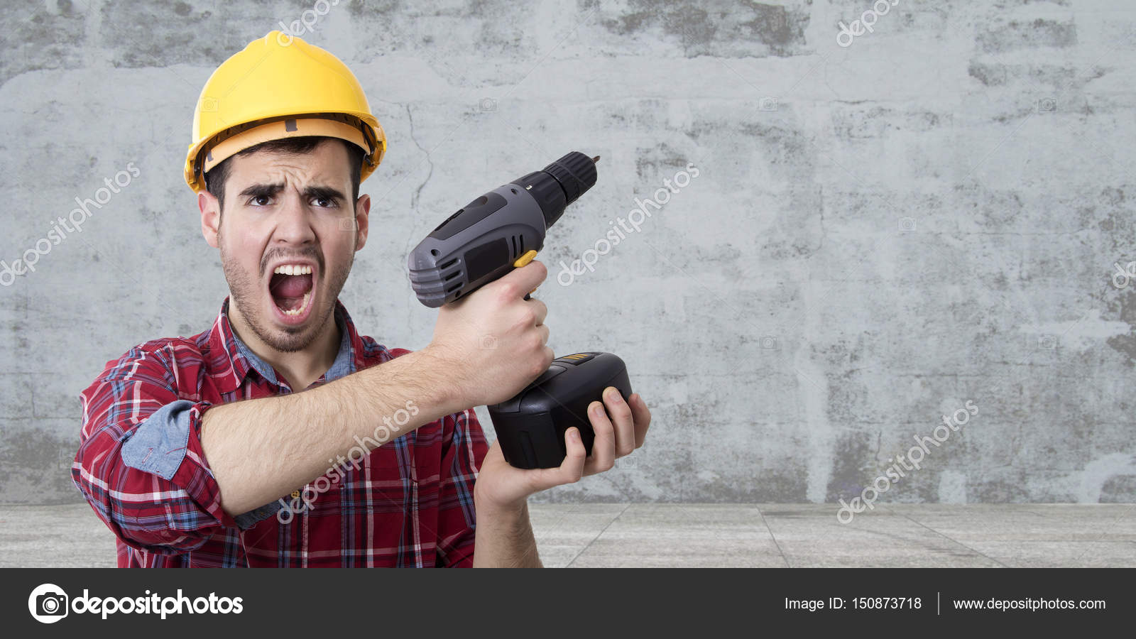 Worker with drill screaming Stock Photo by ©carballo 150873718