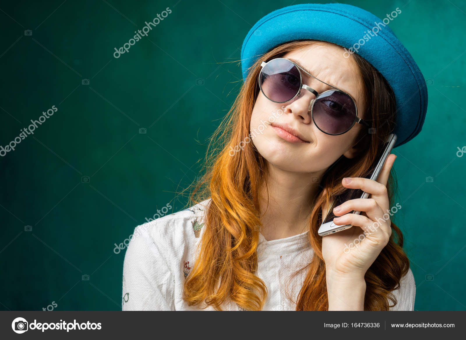 Confident woman holds smartphone and — Stock Photo © mne_len #164736336 Confident woman holds smartphone and — Stock Photo © mne_len #164736336