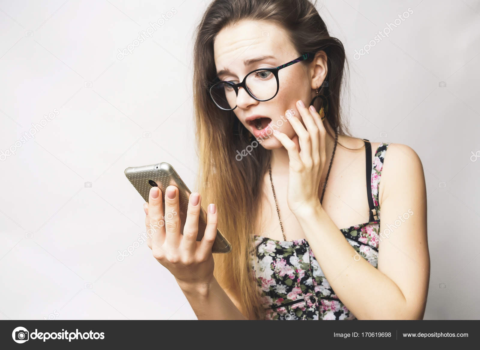 Surprised sad face female with phone, nice girl with glasses Stock ...
