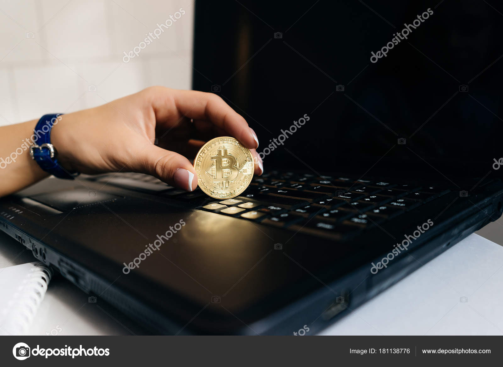 Girl holds a crypt in his hand on a laptop background — Stock Photo ...