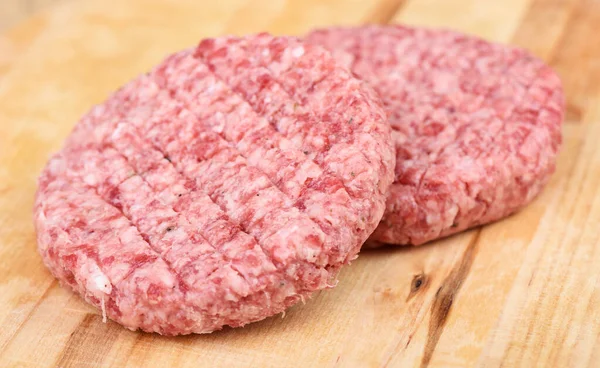 Two raw pink beef cutlets isolated on a white background. Stock Photo ...