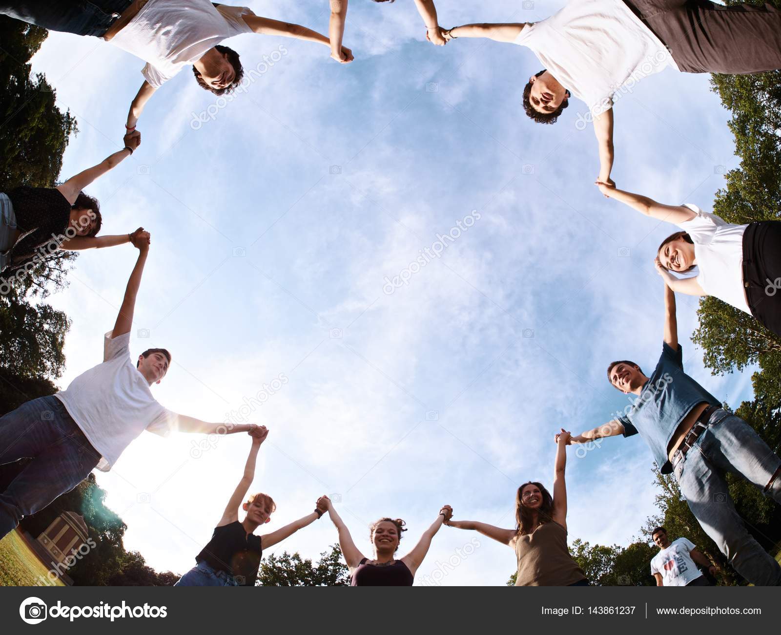 People Holding Hands In A Circle