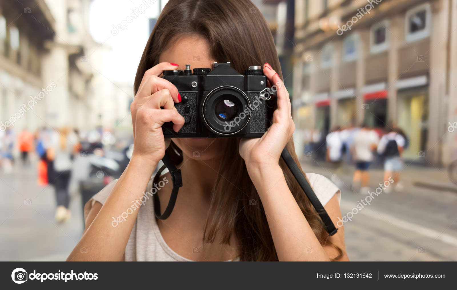 Female photographer using a camera — Stock Photo © minervastock #132131642