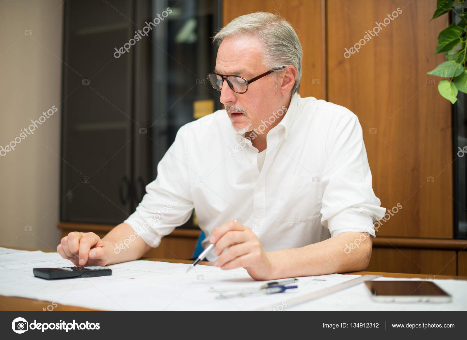 Man at work in his office — Stock Photo © minervastock #134912312