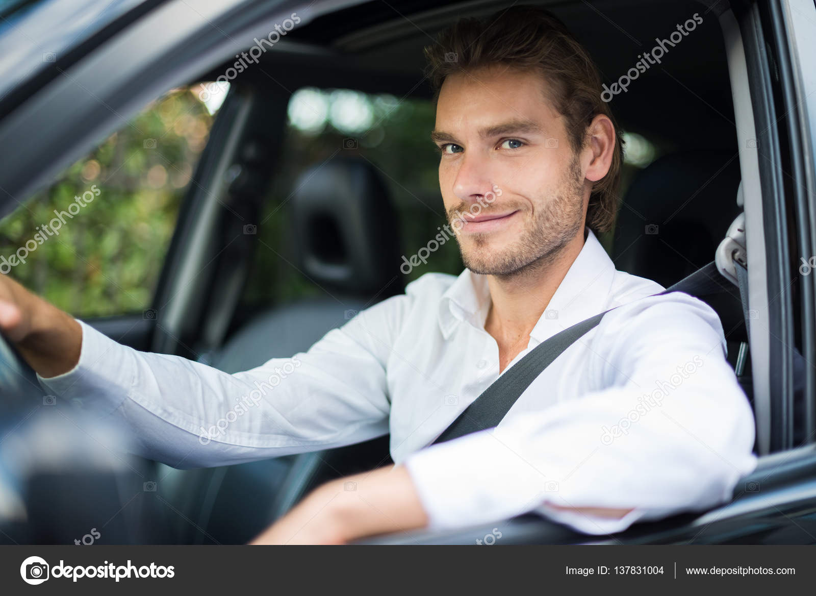 Smiling man driving car — Stock Photo © minervastock #137831004 Smiling man driving car — Stock Photo © minervastock #137831004