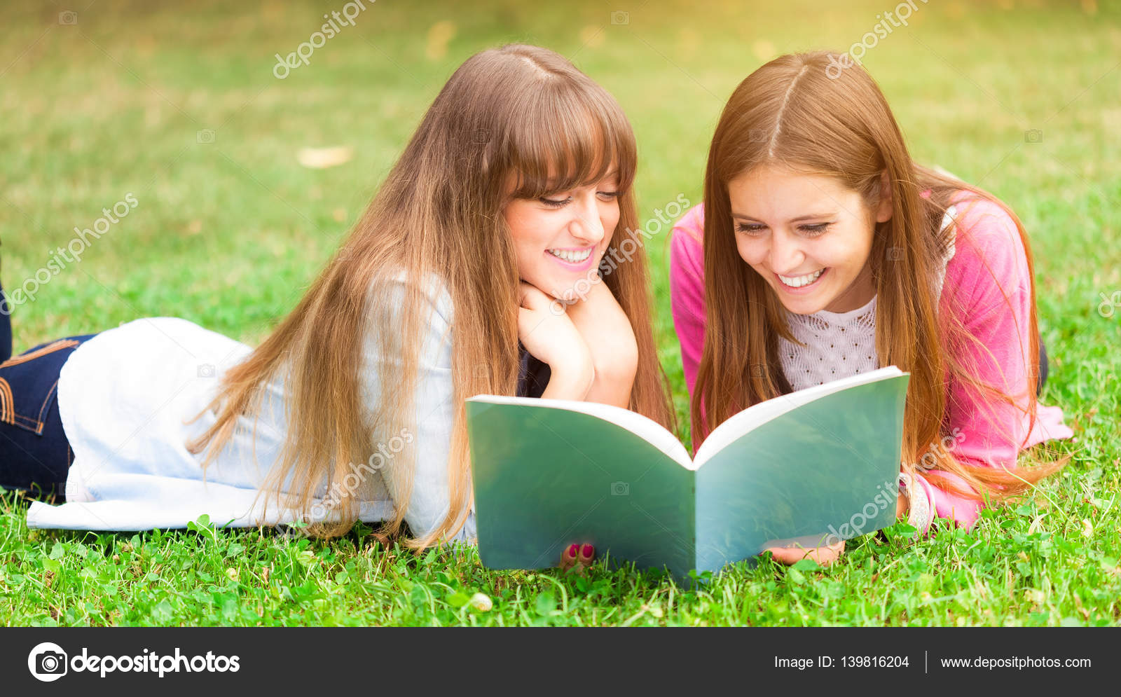 Female students reading book Stock Photo by ©minervastock 139816204