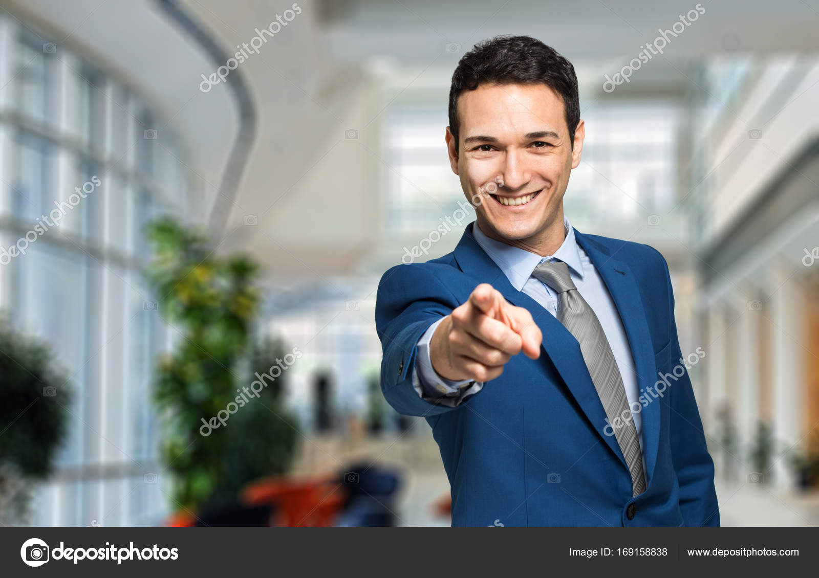 Handsome businessman pointing at camera Stock Photo by ©minervastock ...