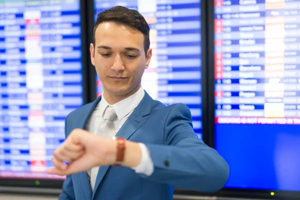 Businessman checking time - Stock Image - Everypixel