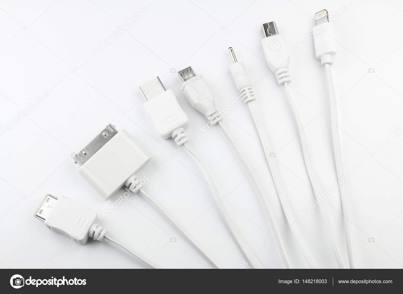 7 different cellphone charging plugs adapter from USB isolated on white ...