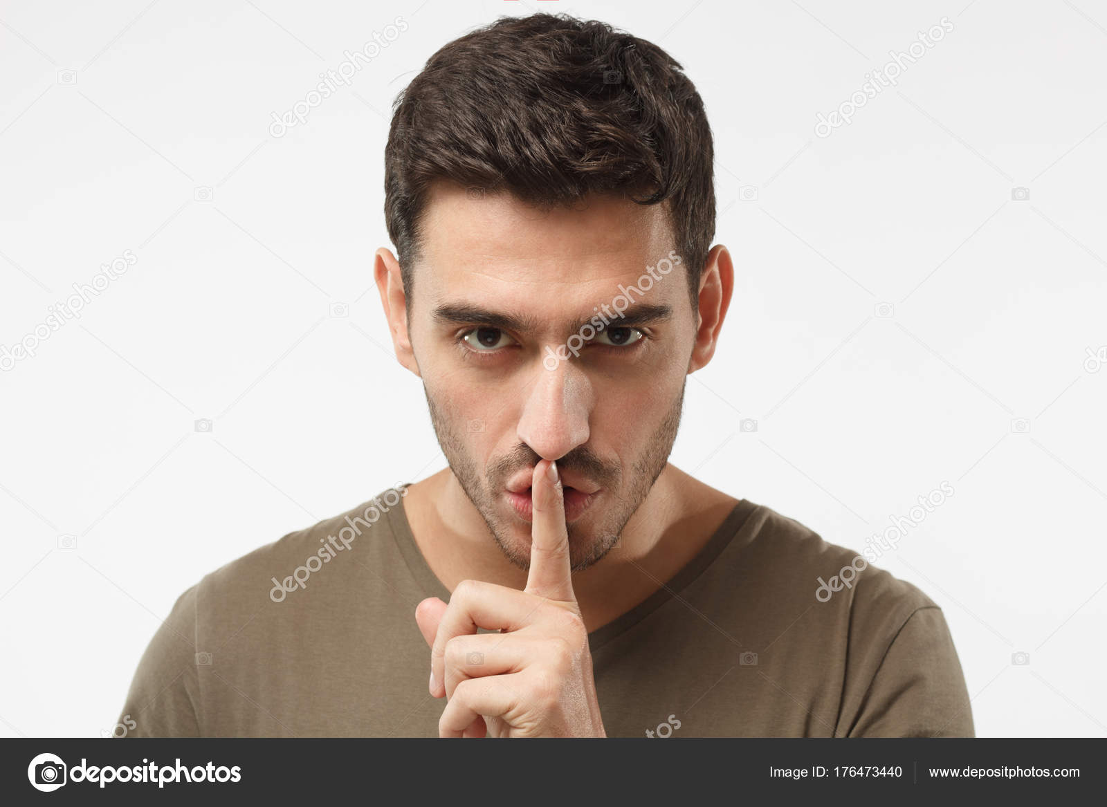 Close Up Shot Of Handsome Male With Shhh Gesture Asking For Silence Or