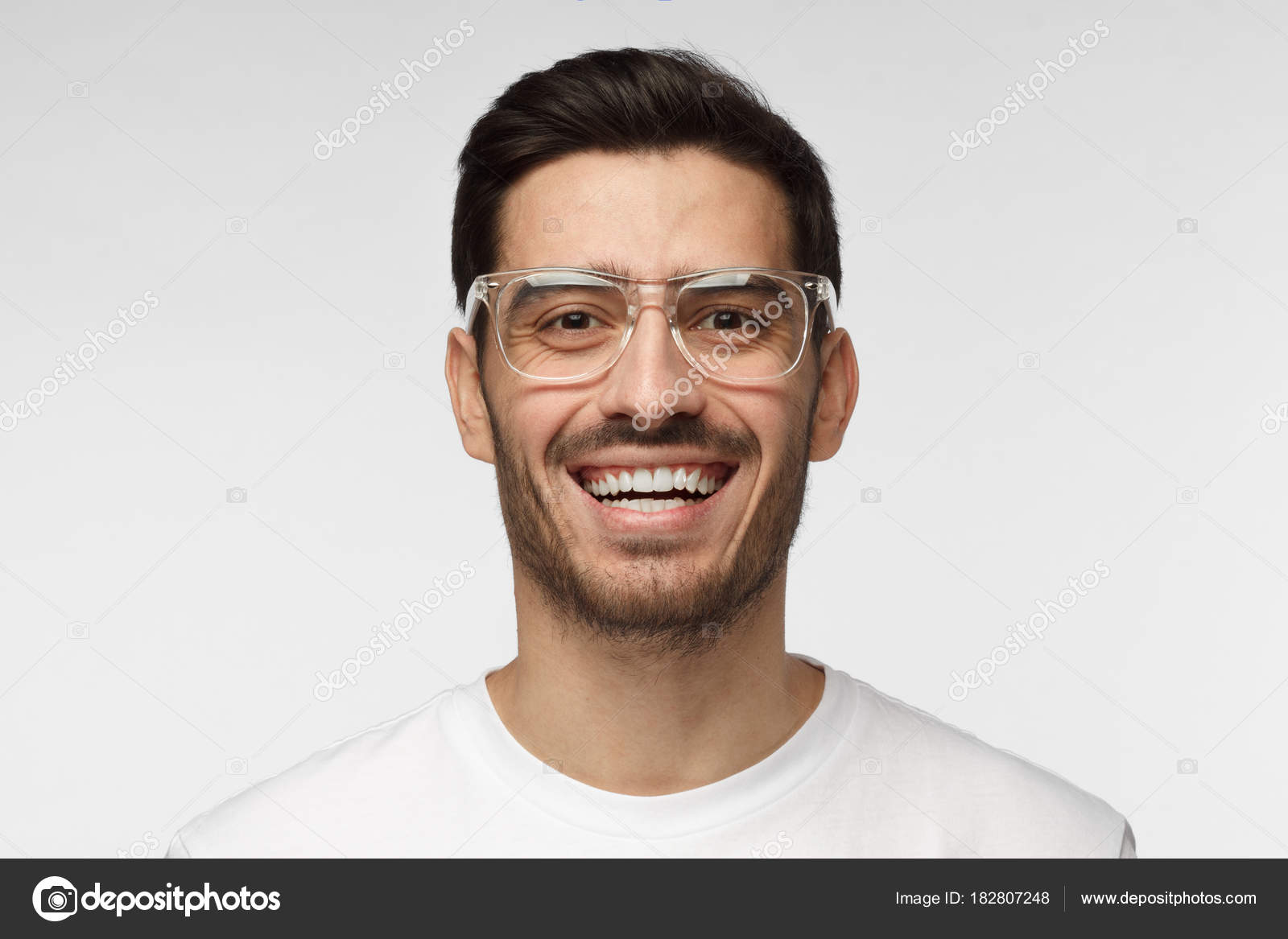 Joyful modern optimistic man smiles broadly, shows white perfect teeth ...