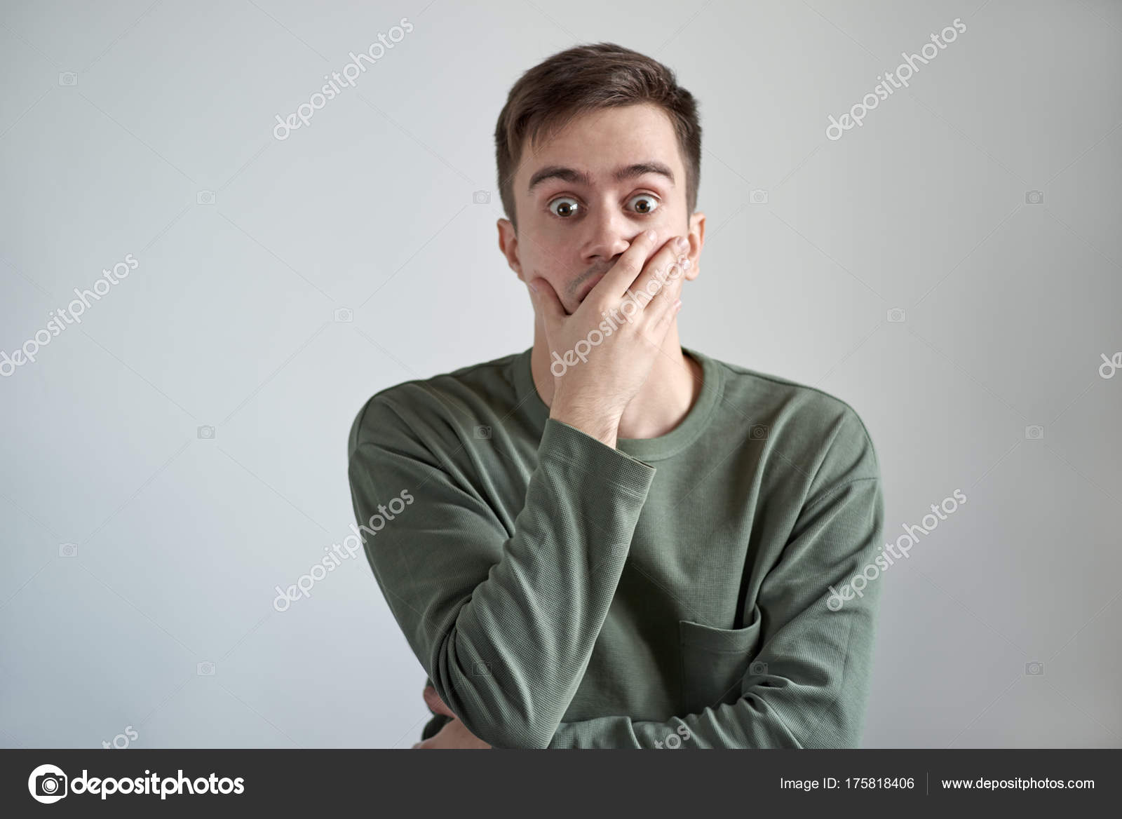 Portrait of a young light-skinned men in casual clothes with a v ...