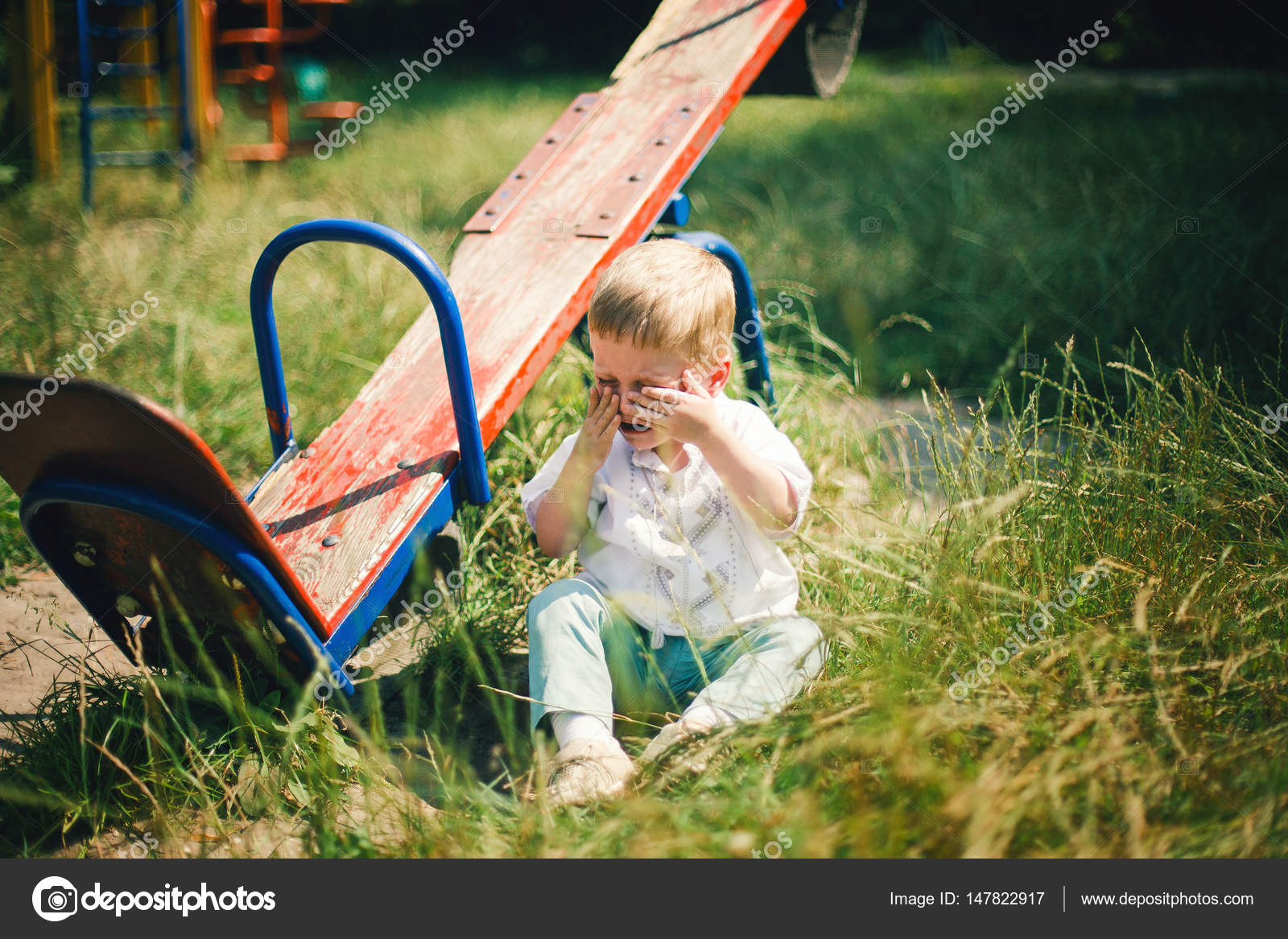 Little boy crying on playground Stock Photo by ©VAKSMANV101 147822917