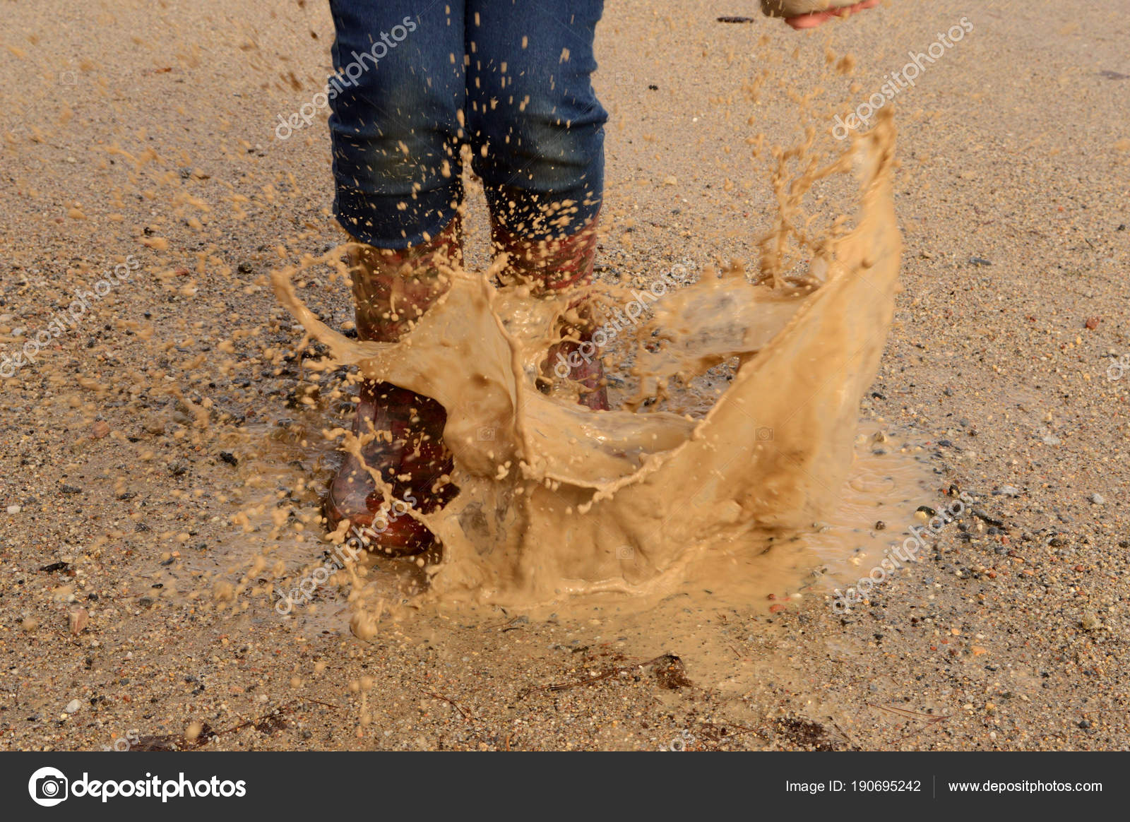 Rubber Boots Splashing Puddle Stock Photo by ©AlphaBaby 190695242