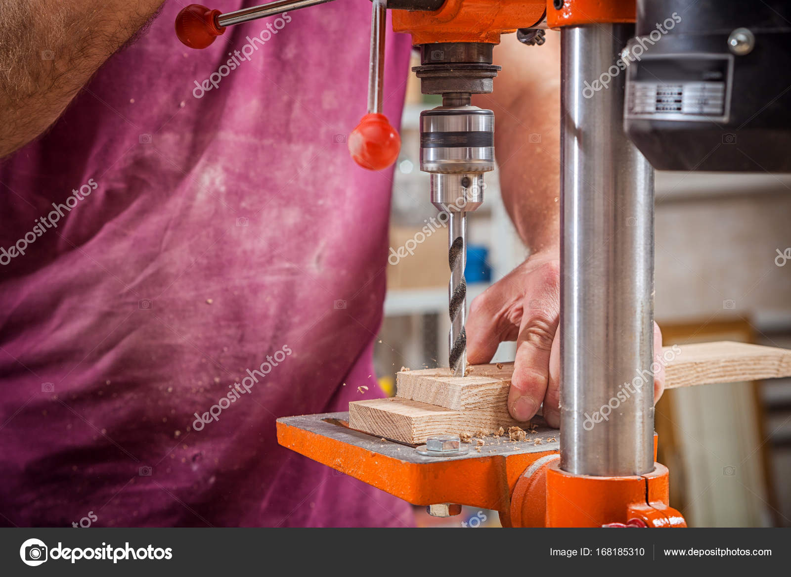 Man working on drilling machine Stock Photo by ©everyonensk 168185310