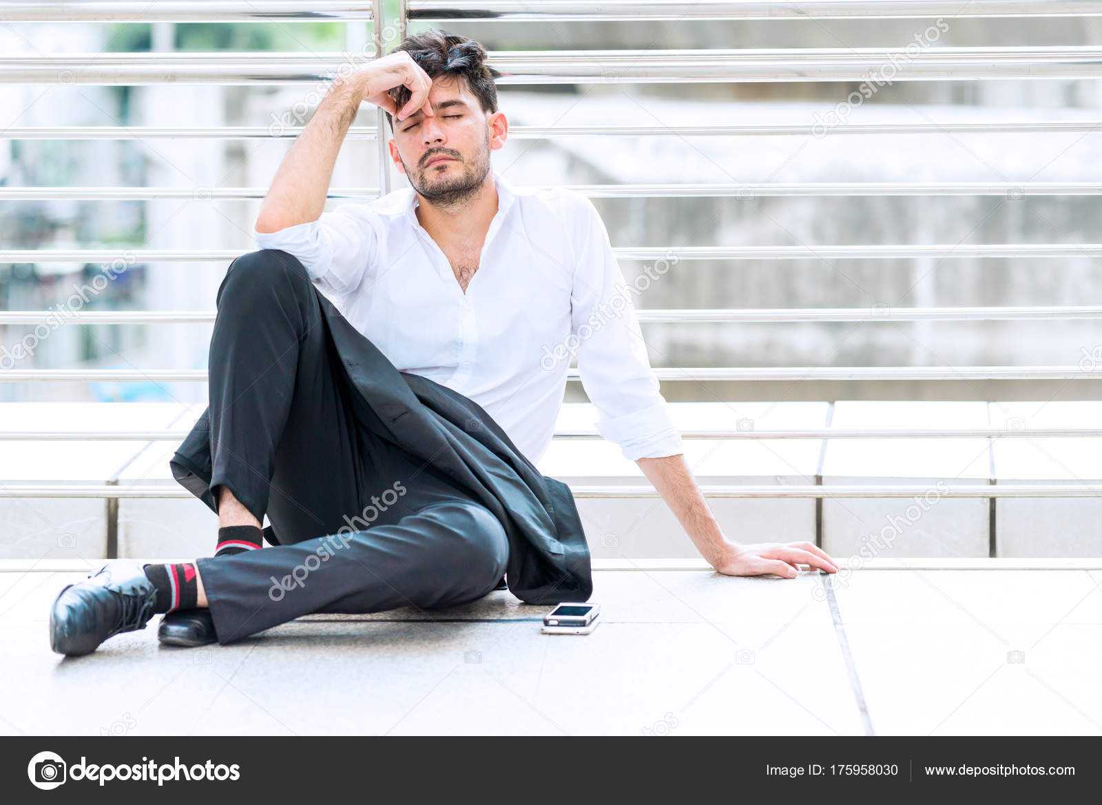Person Sitting On Ground Facing Away