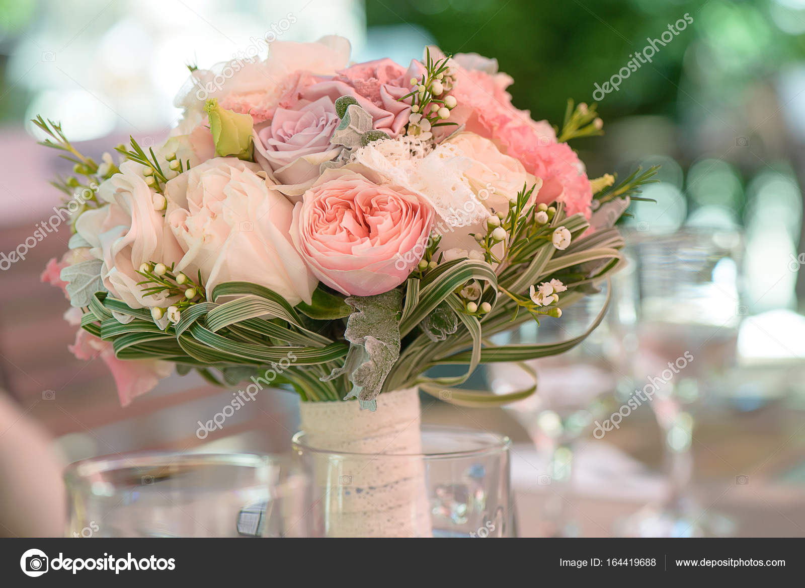 Round bridal bouquet featuring pastel color peonies and roses, lace and ...