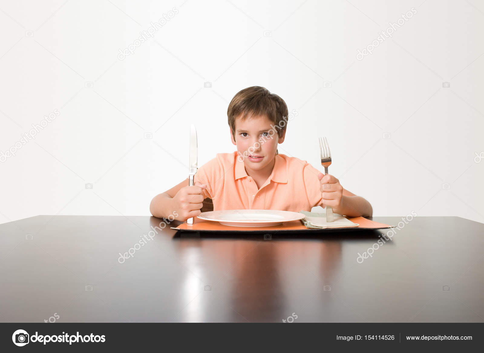 Boy Setting The Table