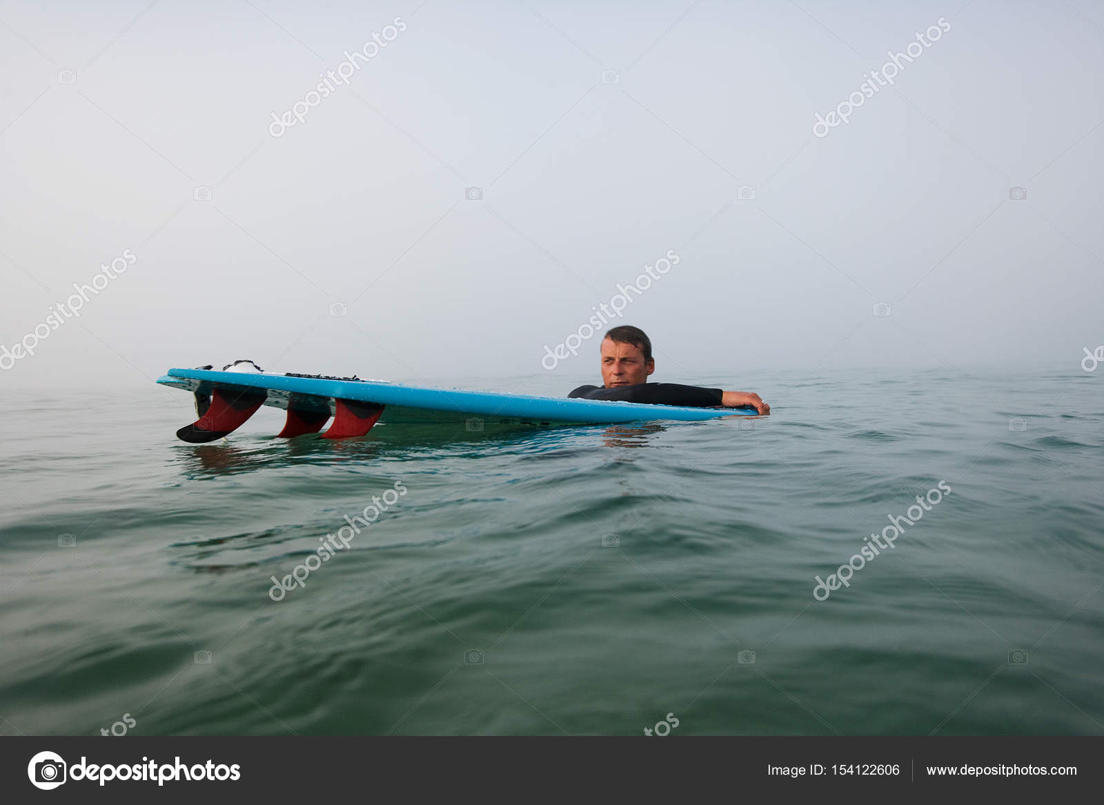 Surfboard Floating On Water