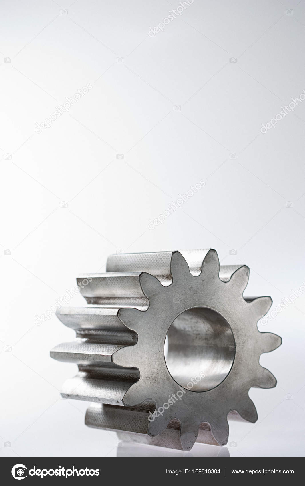 Close Machine Cog White Background Stock Photo by ©ImageSource 169610304