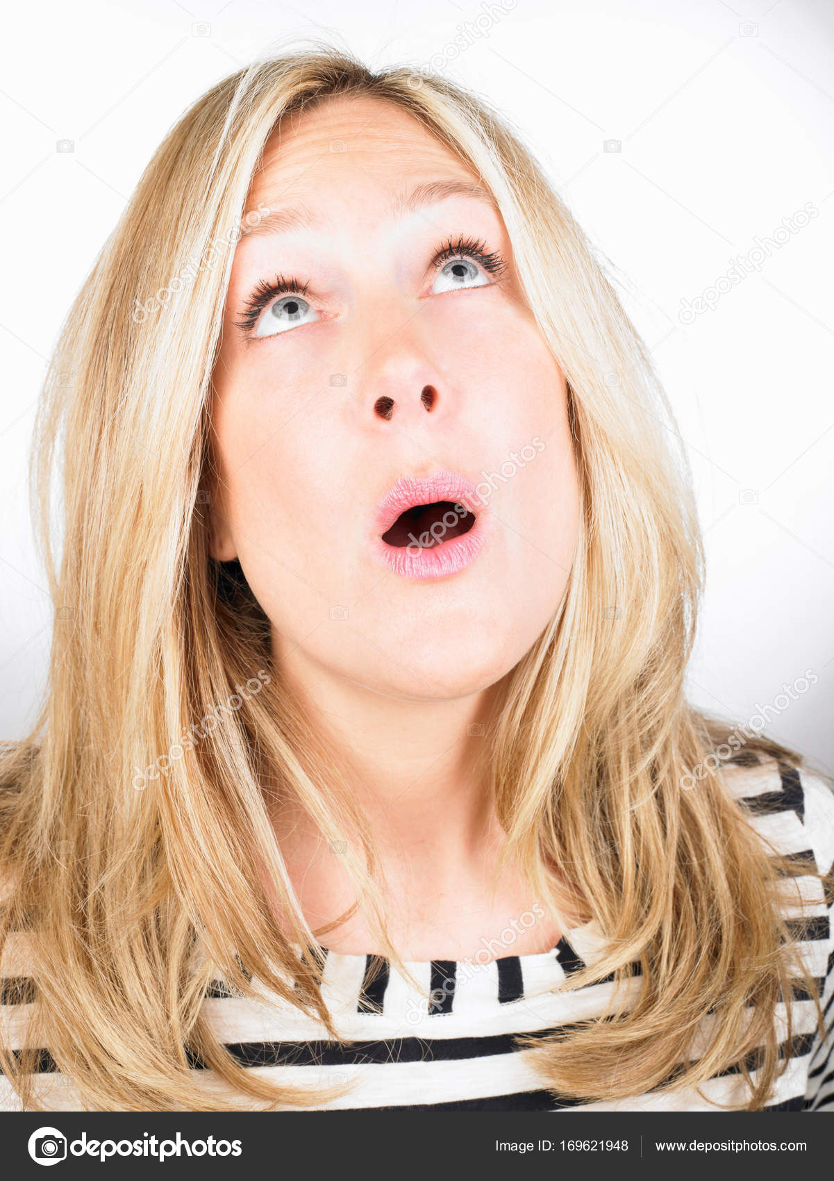 Surprised Woman Looking Stock Photo by ©ImageSource 169621948