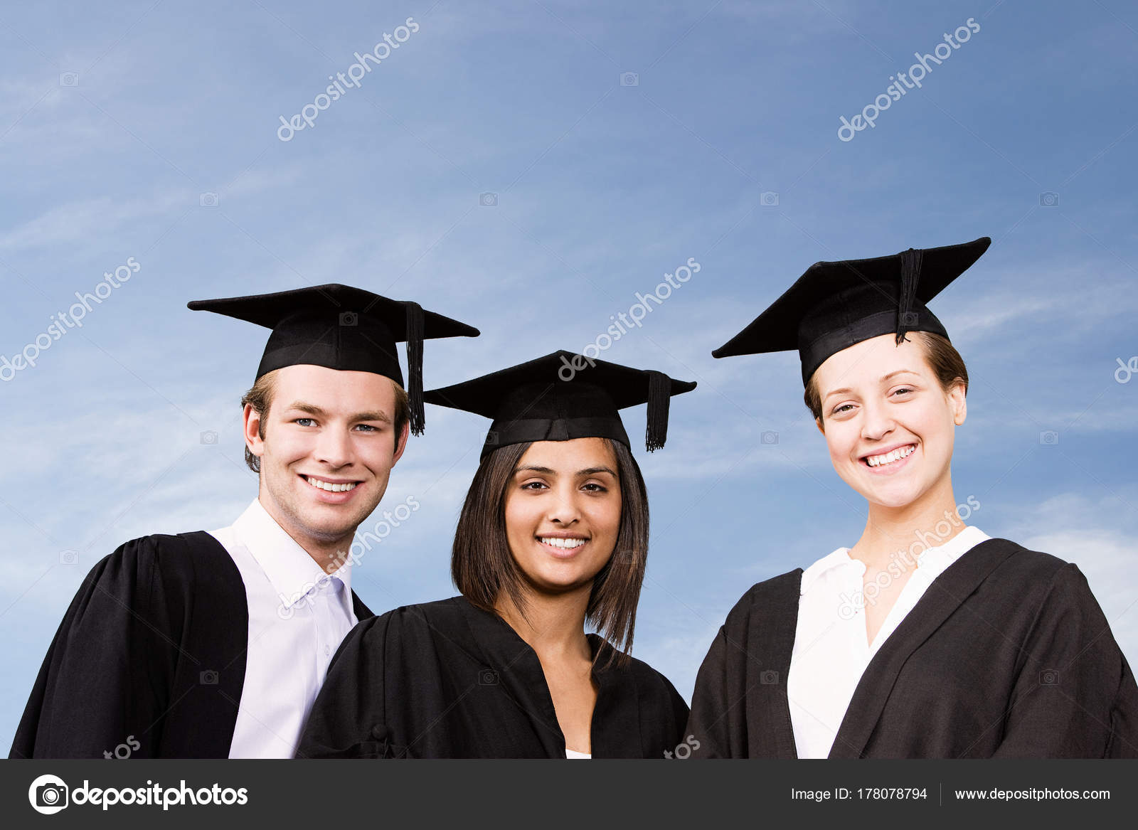 Graduating Students Smiling Blue Sky — Stock Photo © ImageSource #178078794
