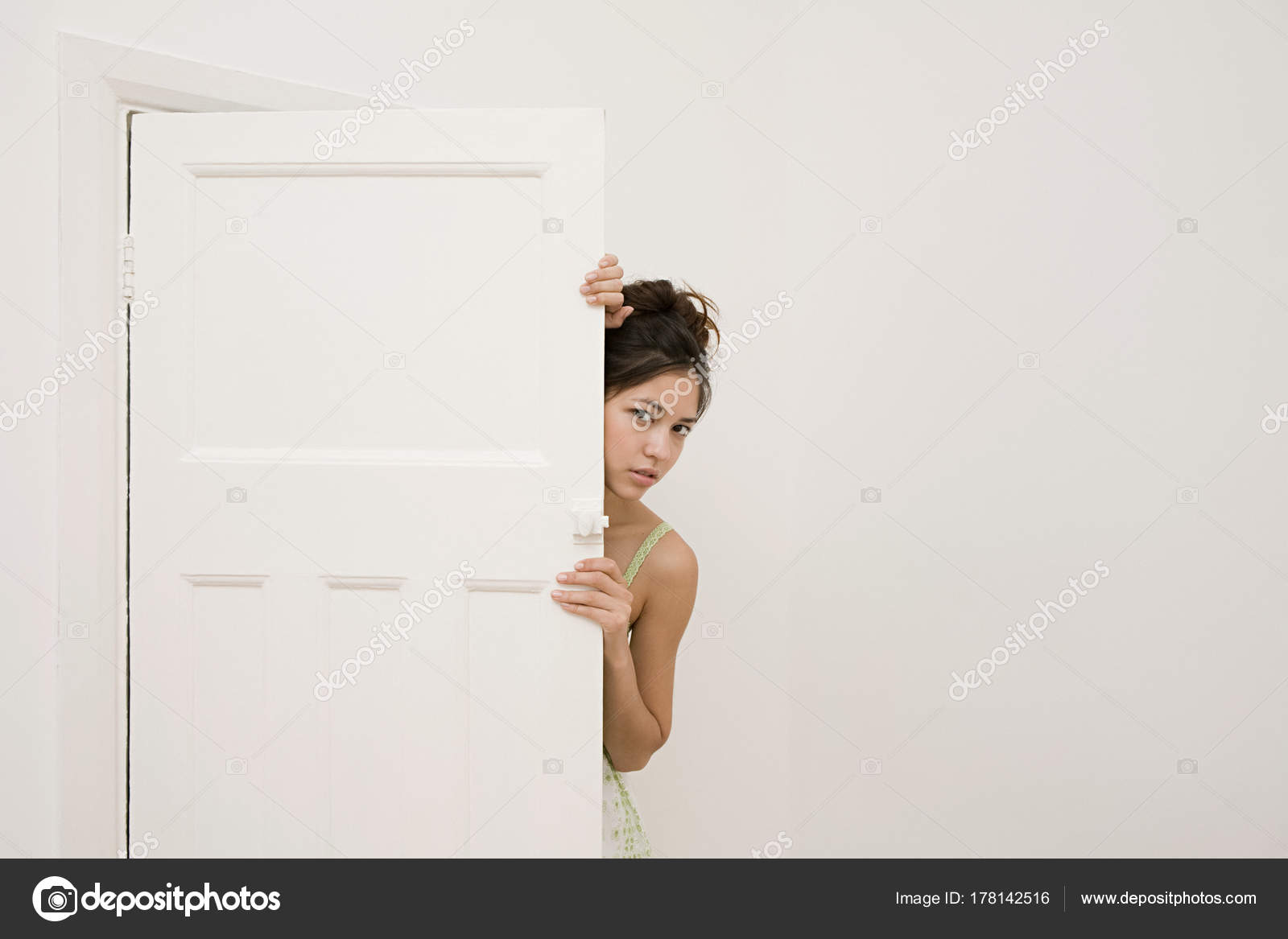 Woman Hiding Door — Stock Photo © ImageSource #178142516