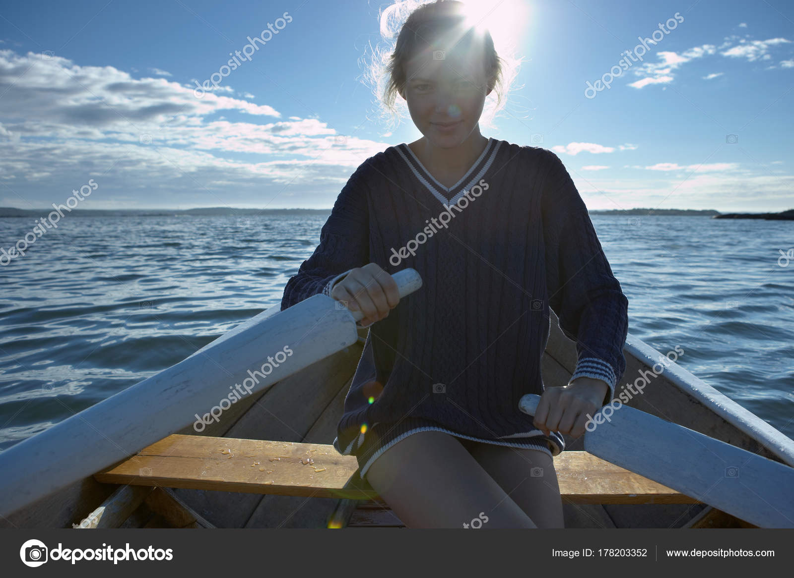 Young Woman Rowing Boat Stock Photo by ©ImageSource 178203352