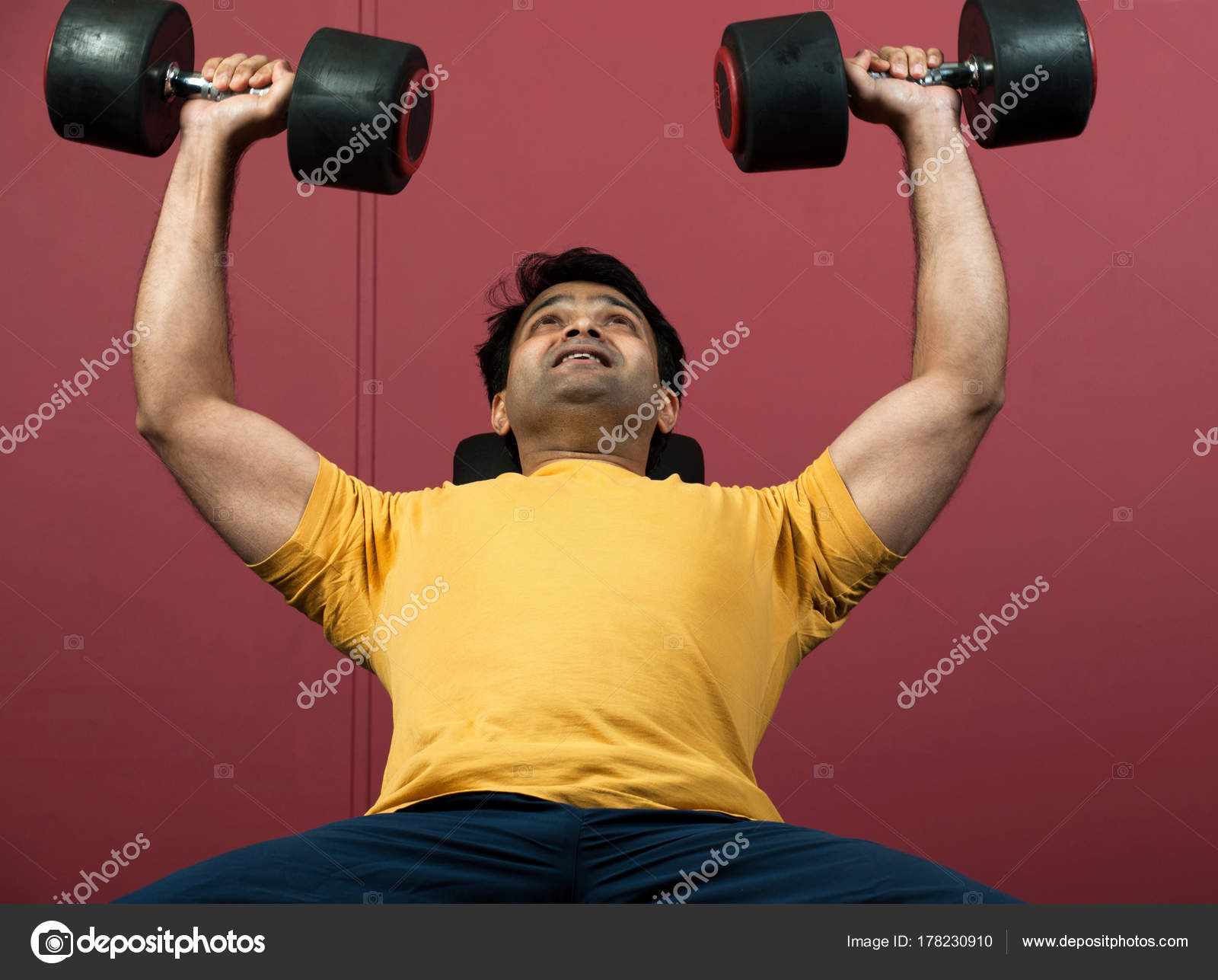 Man Lifting Weights Gym — Stock Photo © ImageSource #178230910