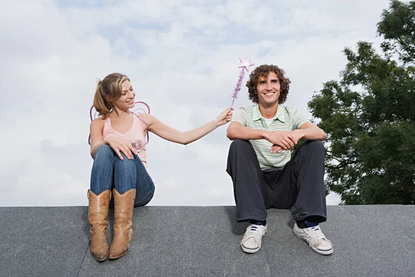 Angel casting a spell on a man - Stock Image - Everypixel