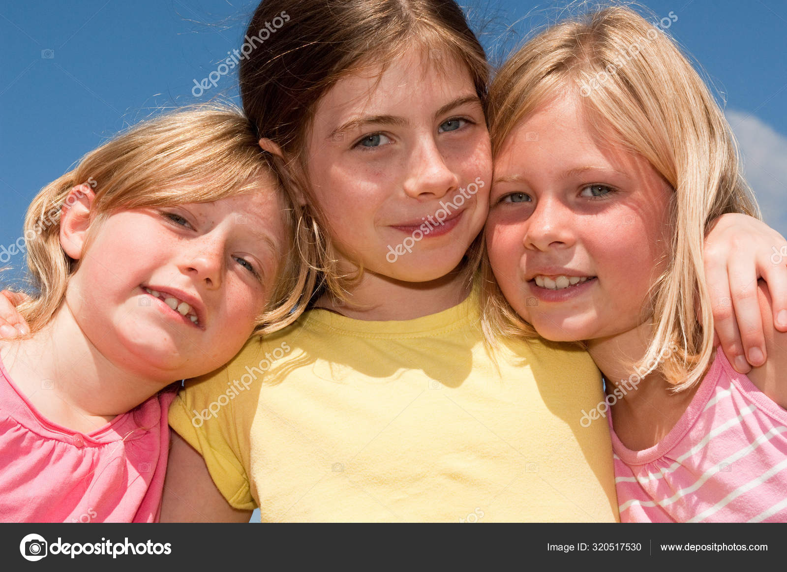 Three Girls Blue Sky Stock Photo by ©ImageSource 320517530
