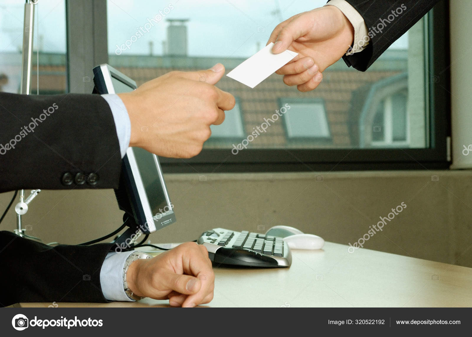 Businessmen Exchanging Cards Office Stock Photo by ©ImageSource 320522192