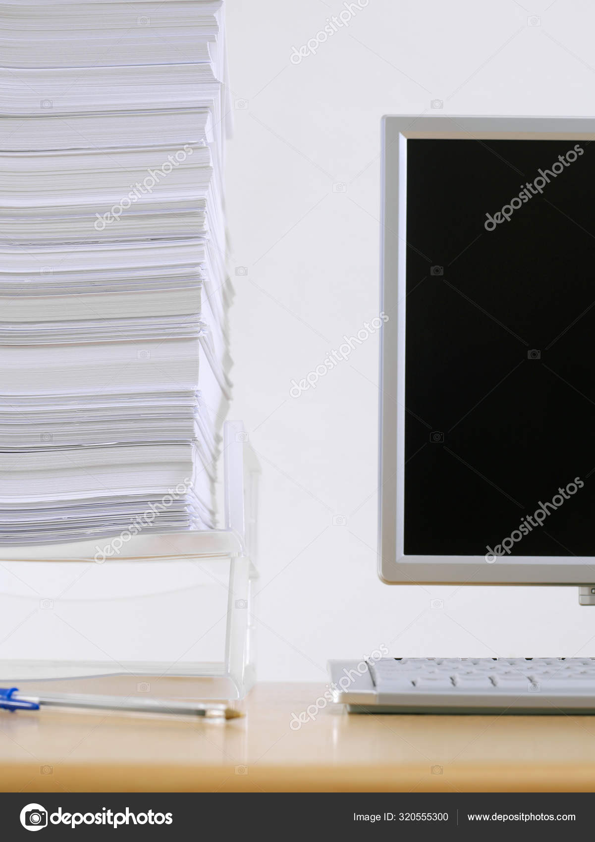 Stack of paperwork in a tray — Stock Photo © ImageSource #320555300